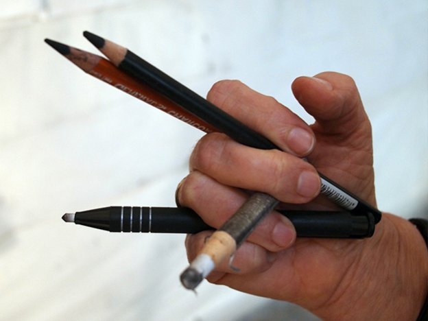 Hand with pens | The Working Artist Learning Site
